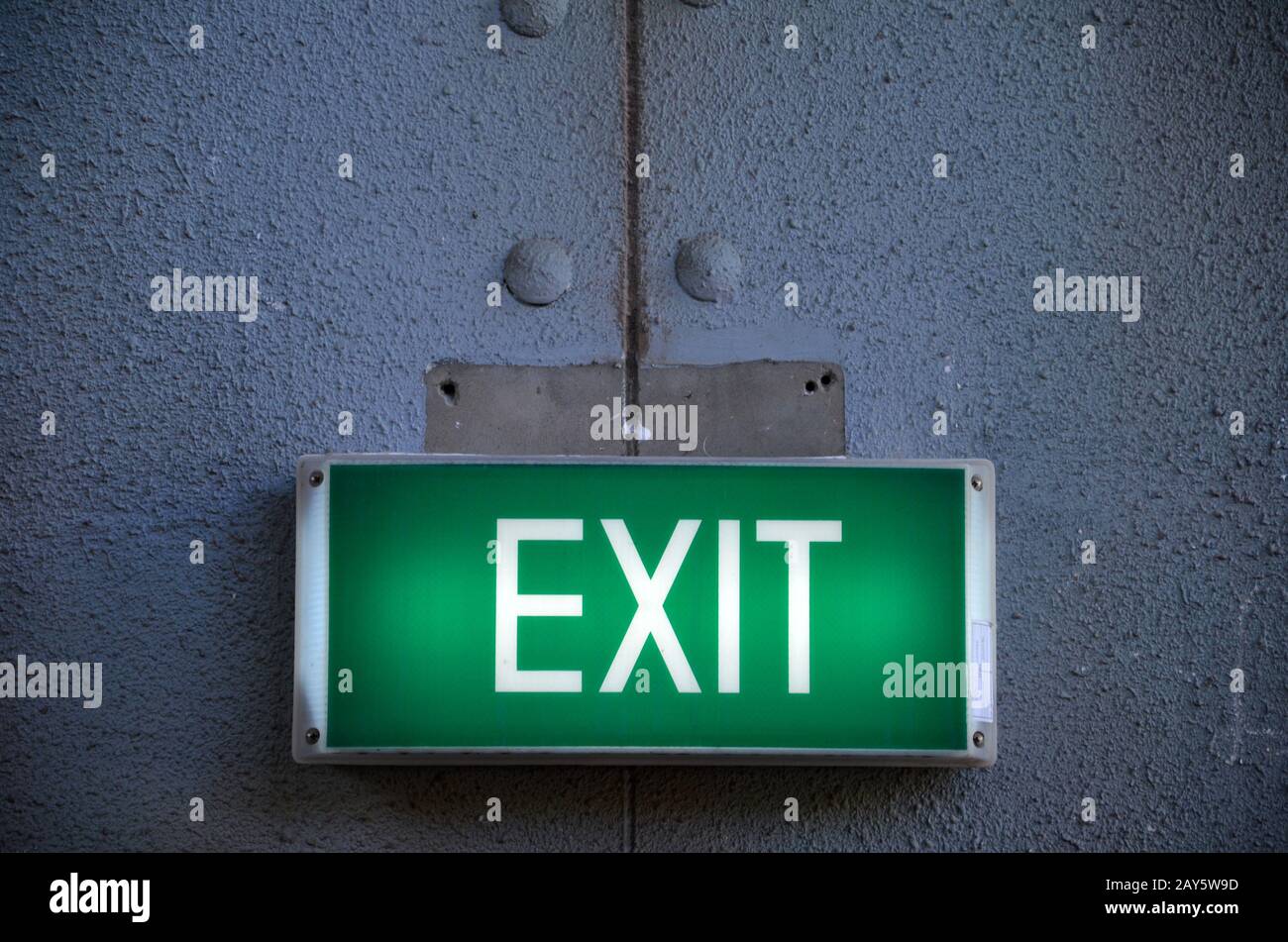 Exit sign points the way out Stock Photo - Alamy