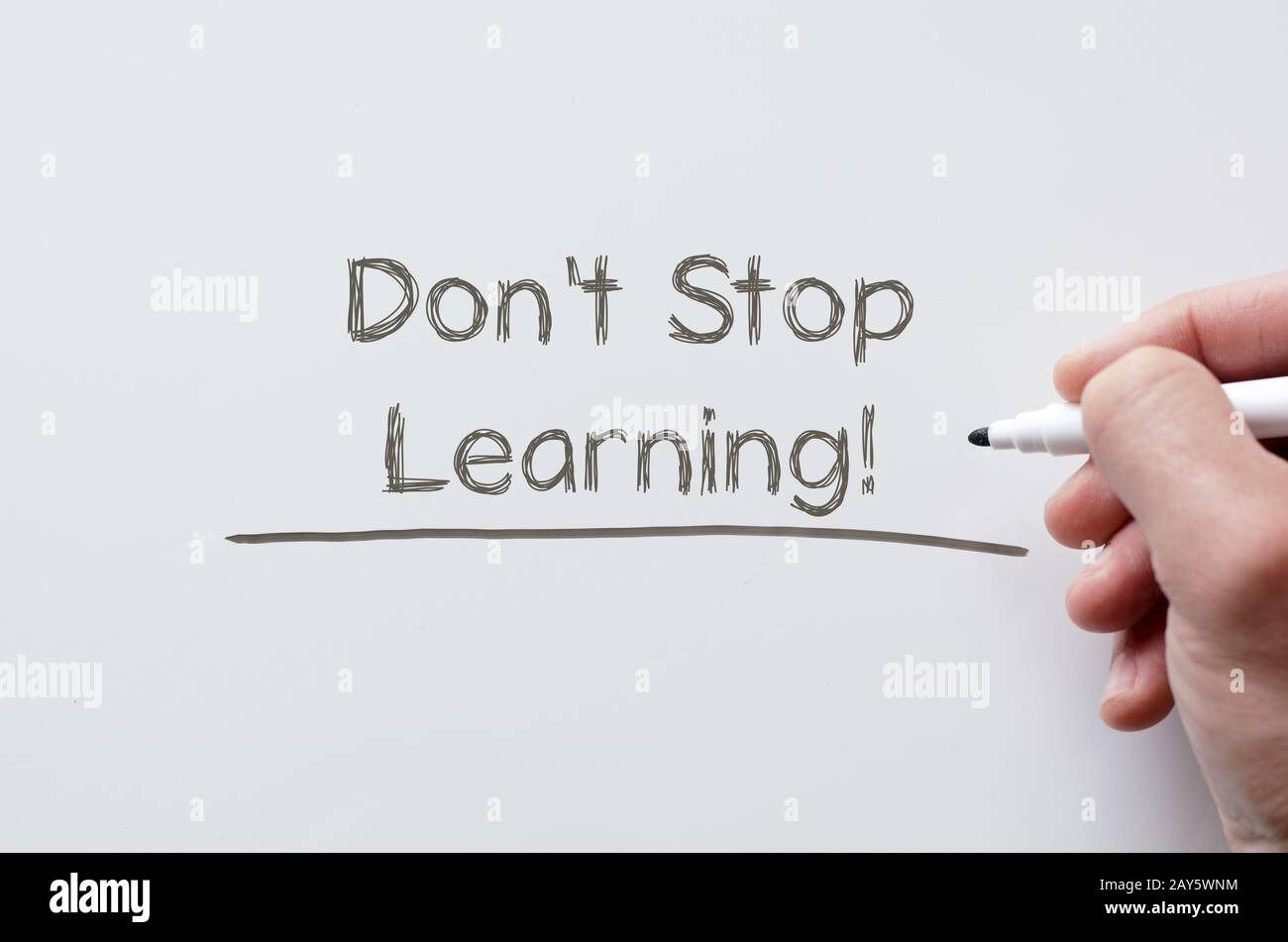 Don't stop learning written on whiteboard Stock Photo - Alamy