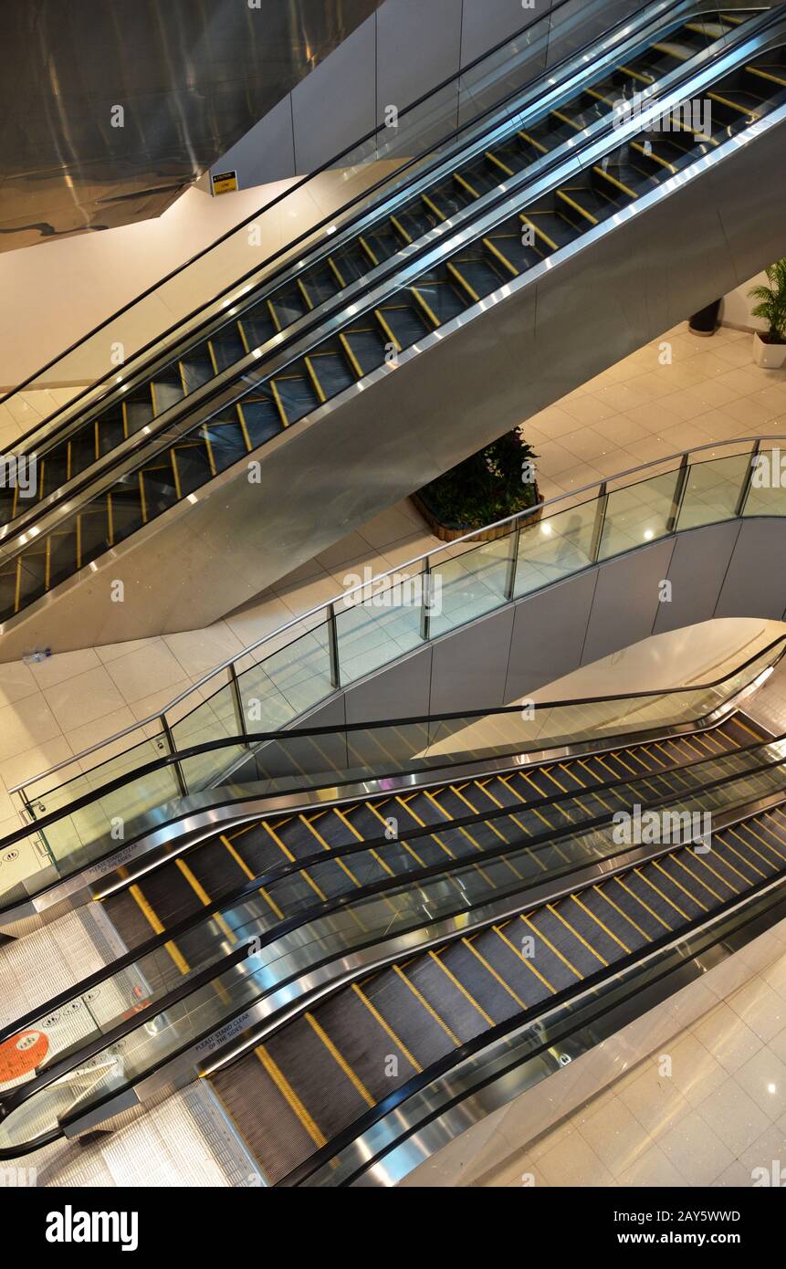 Looking down at multiple escalators Stock Photo - Alamy