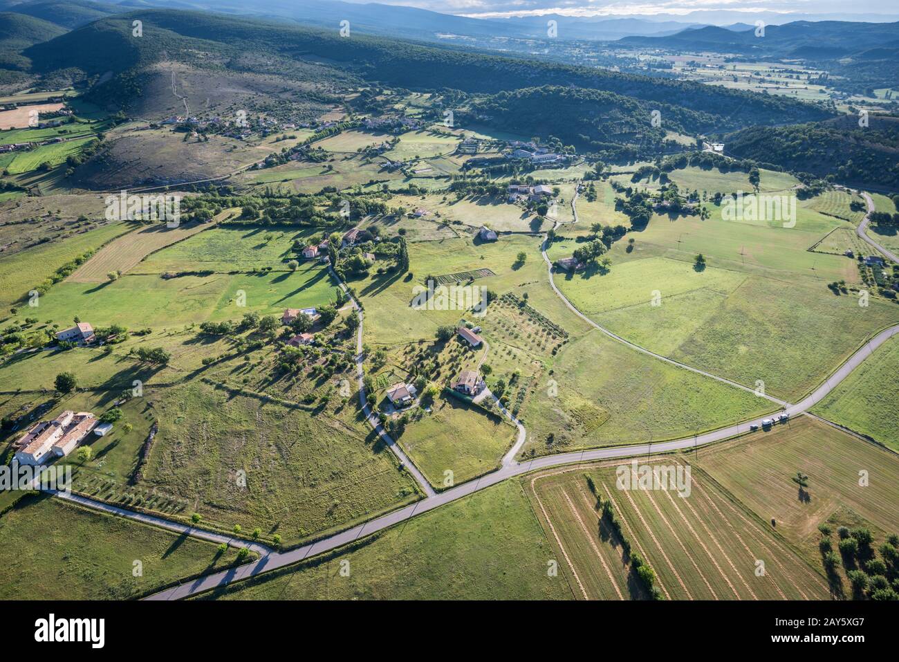 Birds eye view of cultivated land, roads and private houses Stock Photo ...