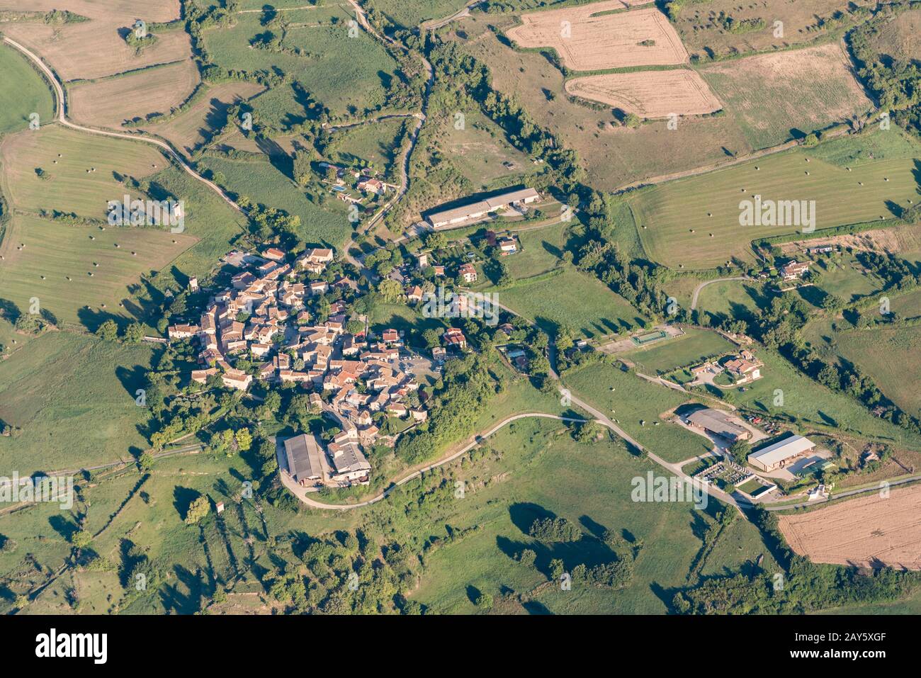 Birds eye view of cultivated land, roads and private houses Stock Photo ...
