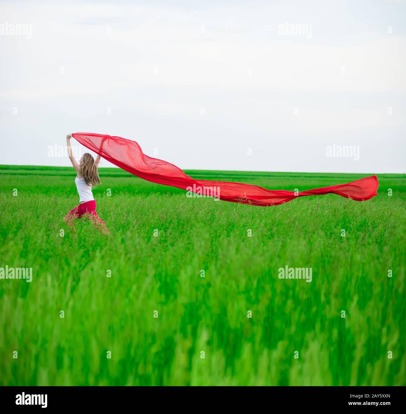 Red silk scarf blowing in wind hi-res stock photography and images - Alamy
