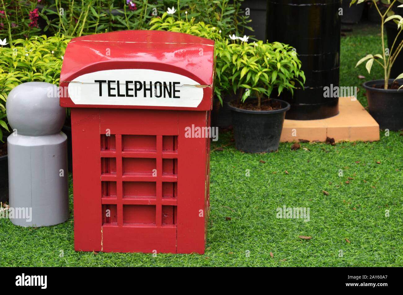 Red british style telephone booth Stock Photo - Alamy