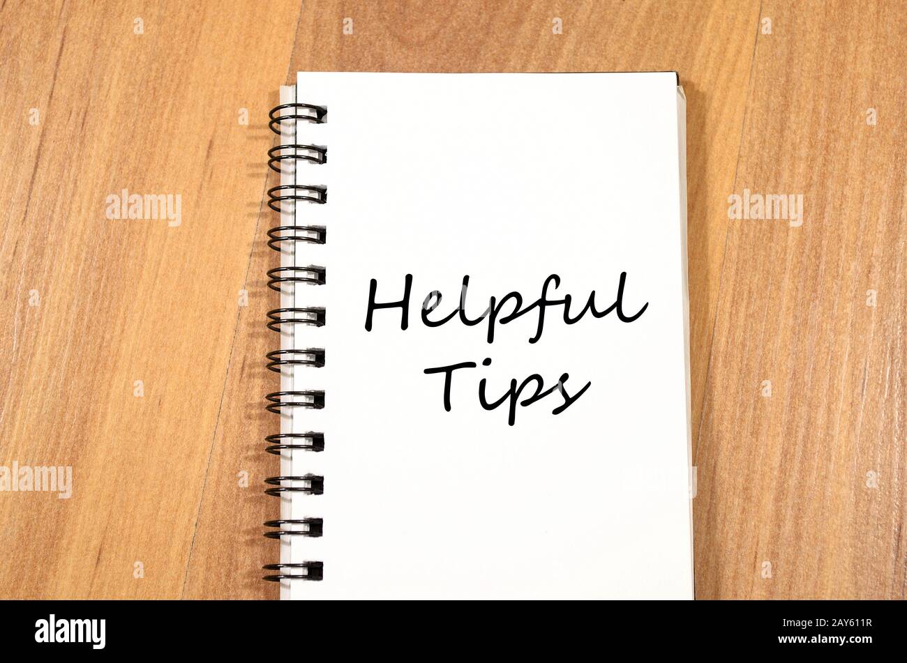 Helpful tips write on notebook Stock Photo - Alamy