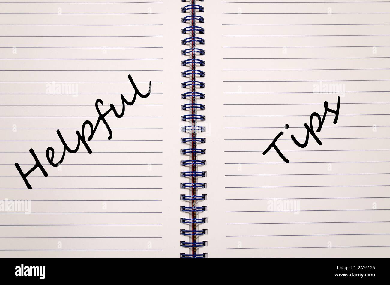 Helpful tips write on notebook Stock Photo - Alamy