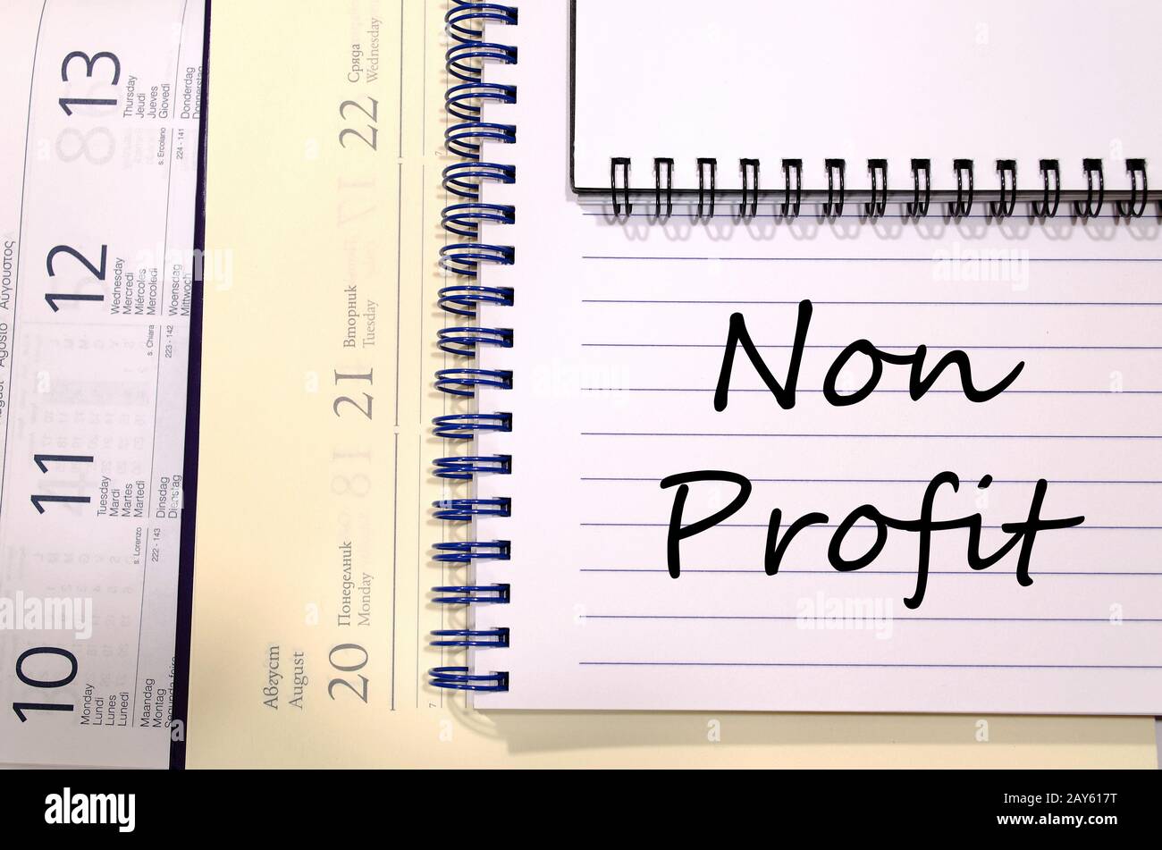 Non profit write on notebook Stock Photo - Alamy