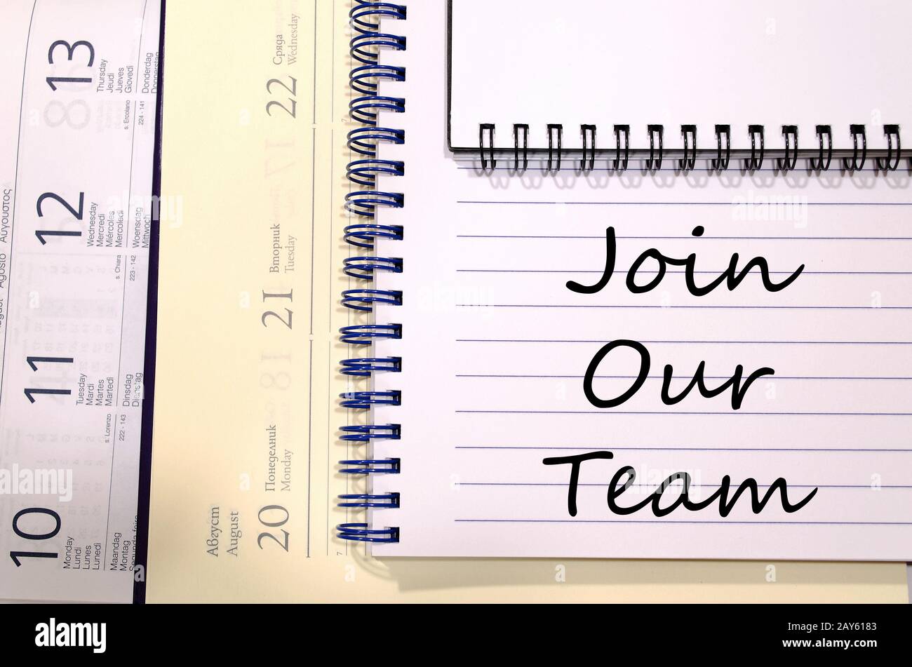 Join our team write on notebook Stock Photo - Alamy