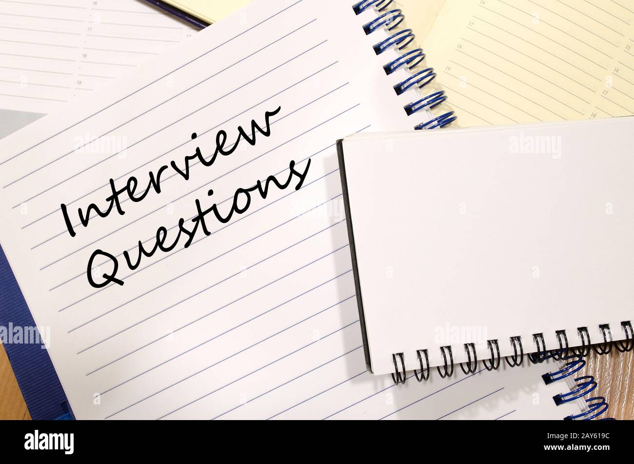 Interview questions write on notebook Stock Photo - Alamy