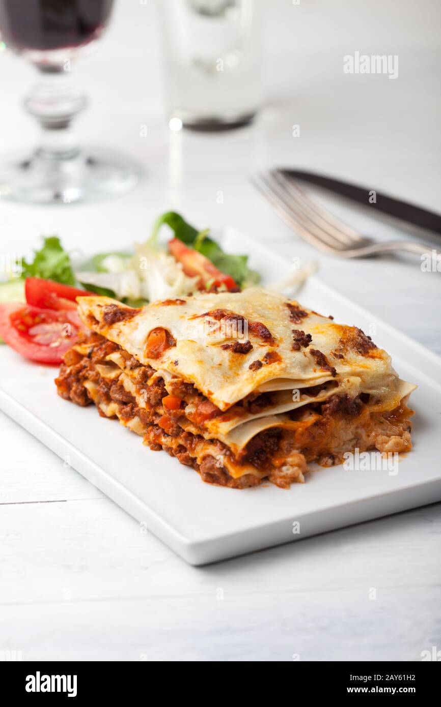 Italian lasagne on a square plate Stock Photo - Alamy