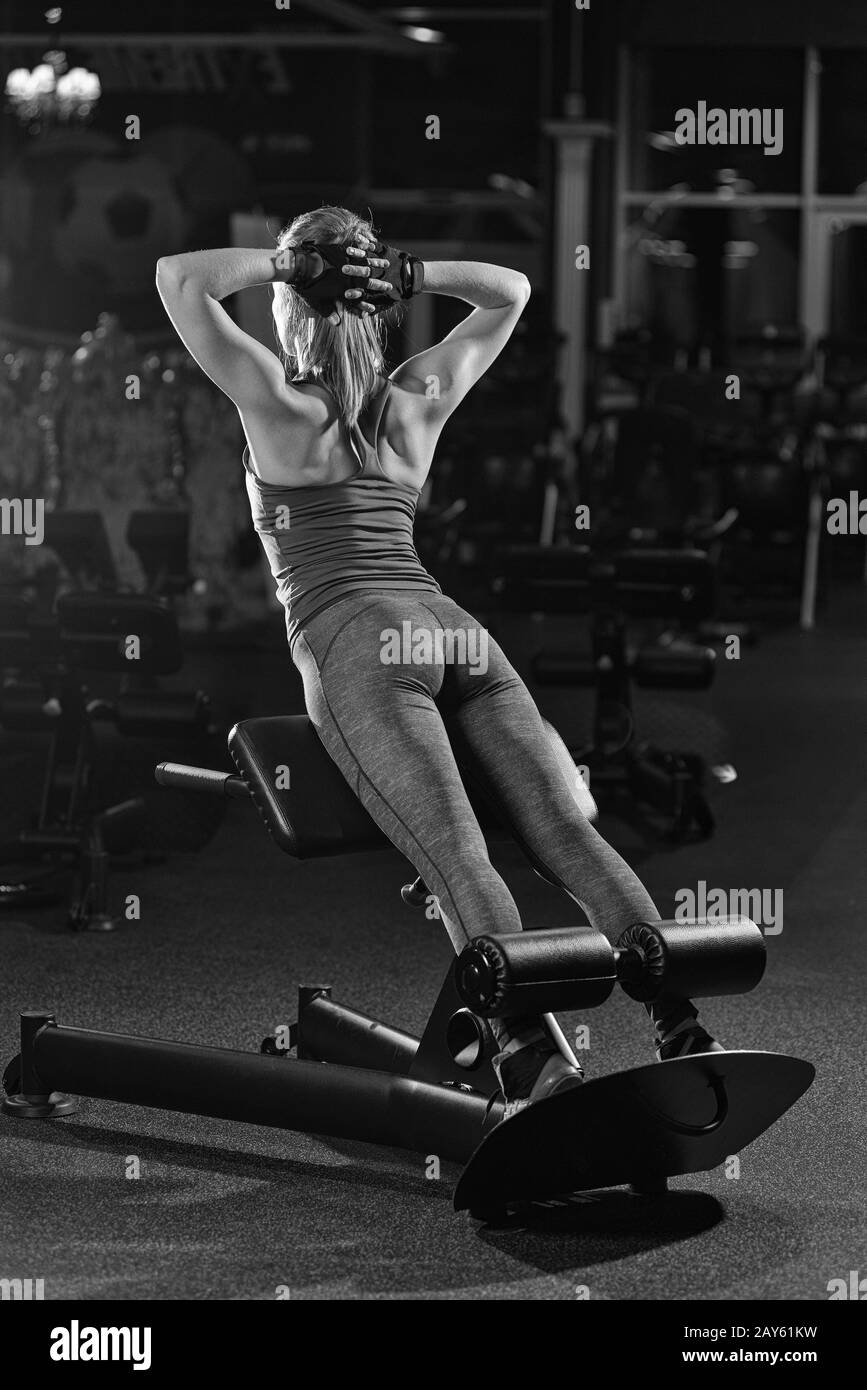 Woman doing strength exercises for abs muscles Stock Photo - Alamy