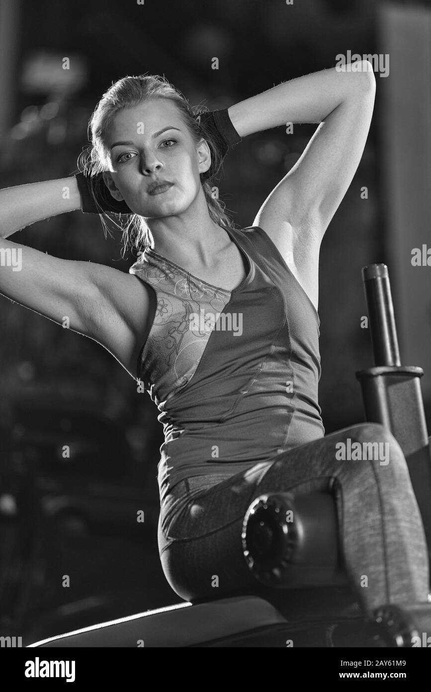 Woman doing strength exercises for abs muscles Stock Photo - Alamy