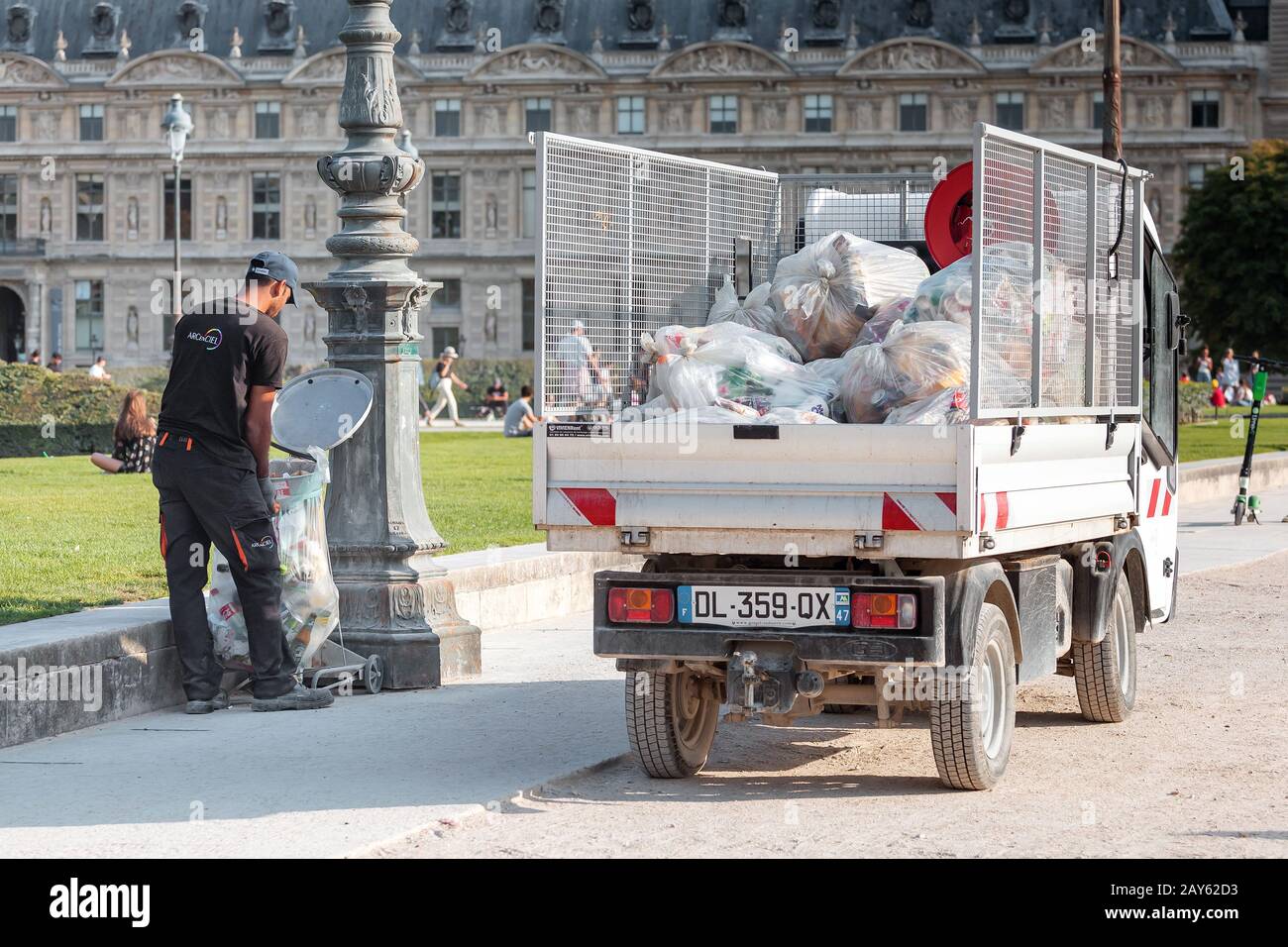 28 July 2019, Paris, France: Worker garbage man cleans up street trash ...