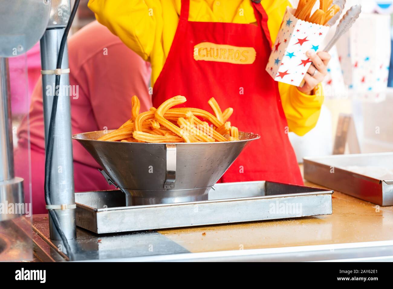 Churros seller hi-res stock photography and images - Alamy