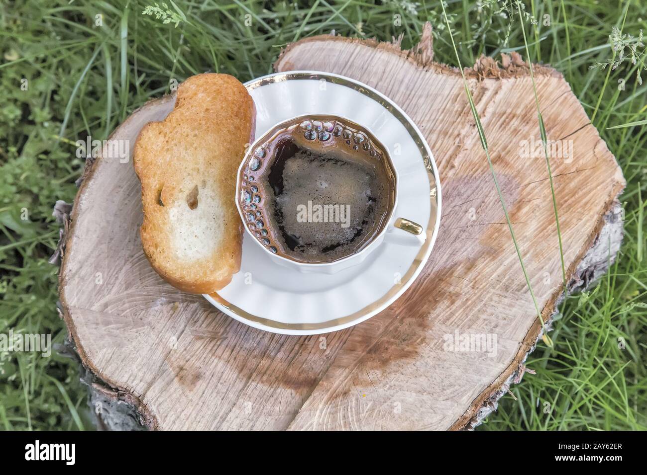 Still life: a Cup of black coffee in the garden Stock Photo - Alamy