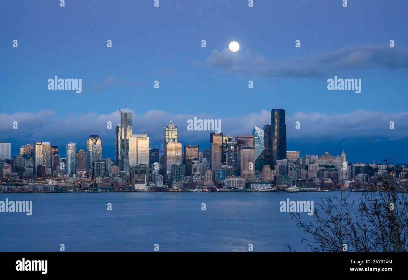 A bright full moon shines over the Seattle skyline Stock Photo - Alamy