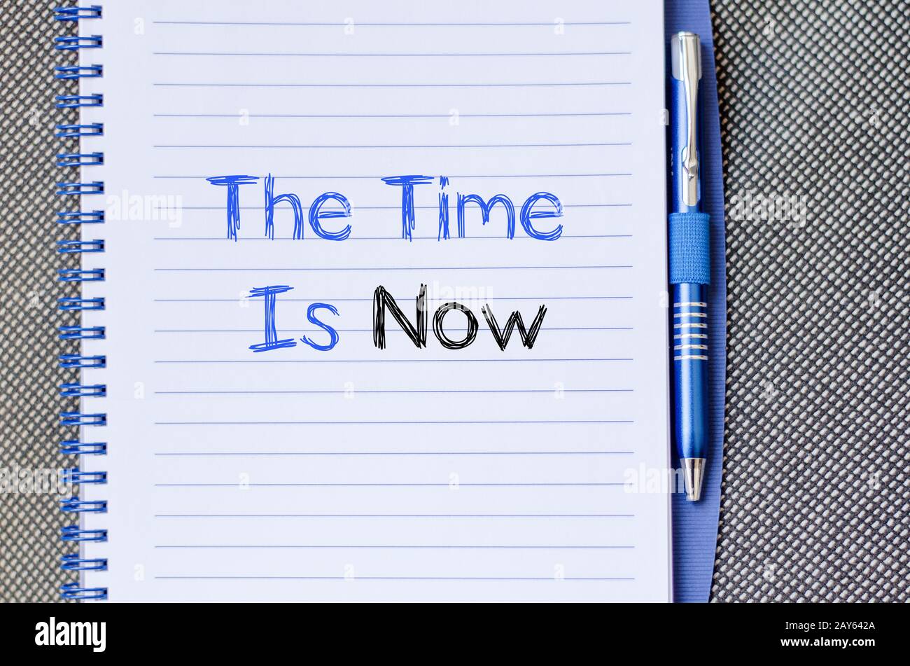 The time is now text concept on notebook Stock Photo - Alamy