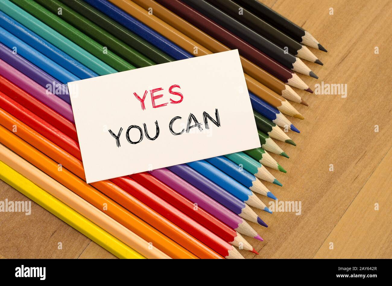 Yes you can text concept over pencil background Stock Photo - Alamy