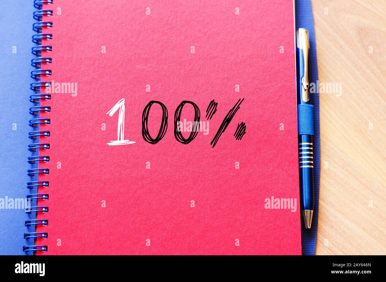 One hundred percent symbol on notebook Stock Photo - Alamy