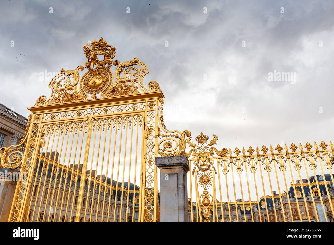 golden gates of the main entrance to the Royal Palace of Versailles ...