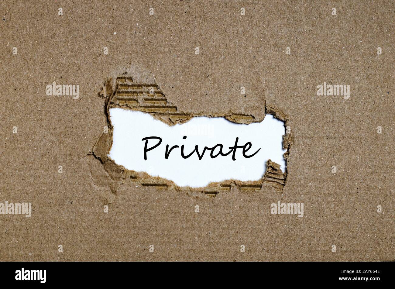 The word private appearing behind torn paper Stock Photo - Alamy