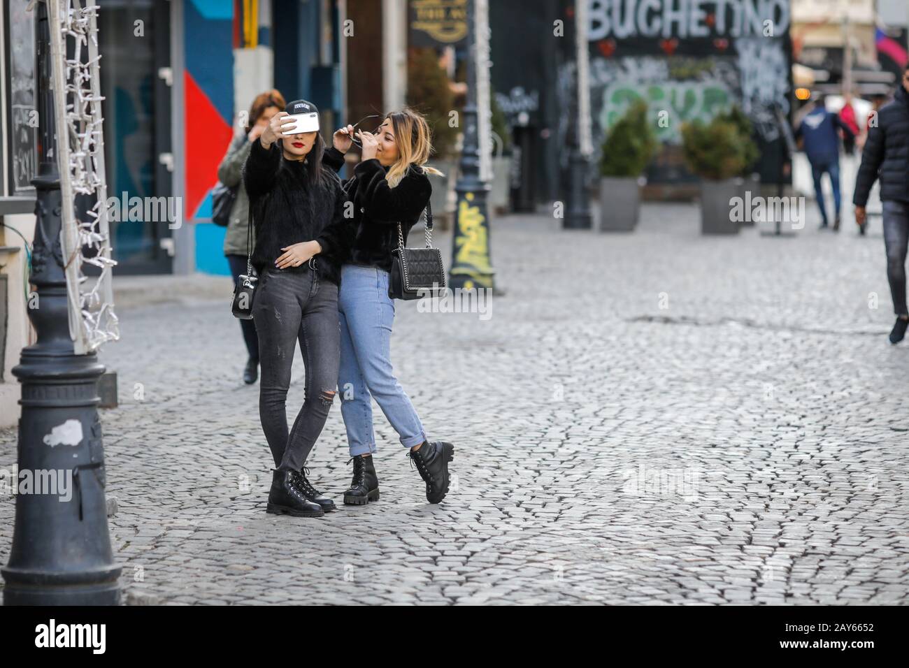 Bucharest, Romania - February 12, 2020: Two young women take a selfie ...