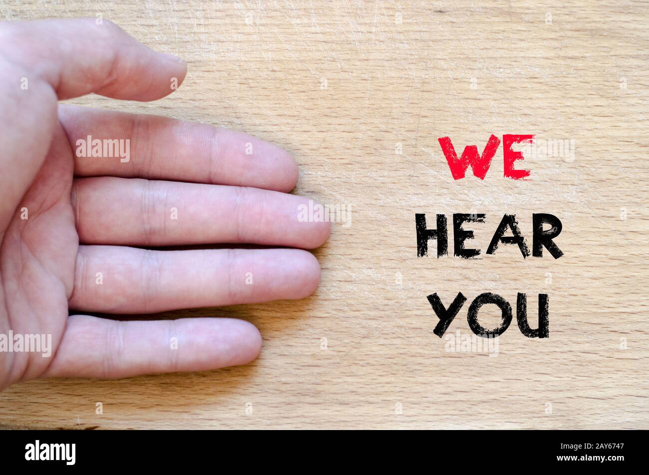 We hear you text concept Stock Photo - Alamy
