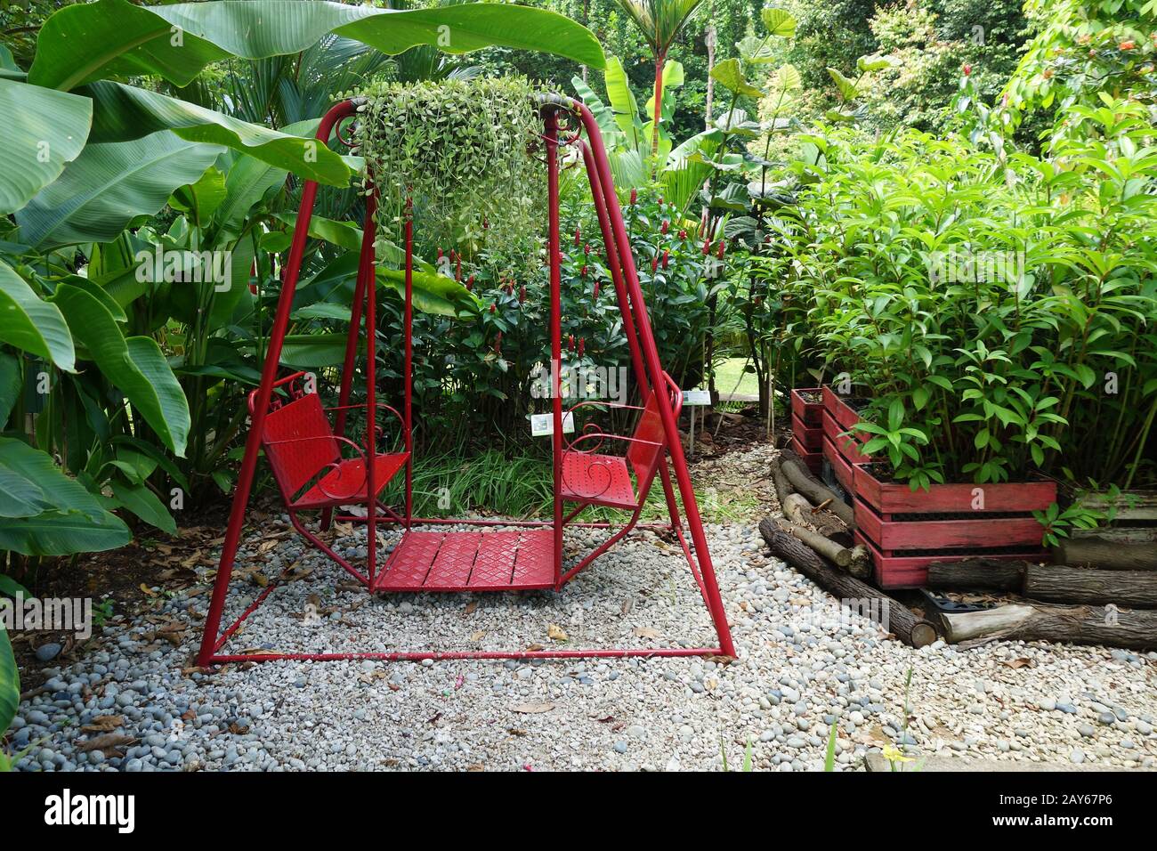 Red swing hi-res stock photography and images - Alamy