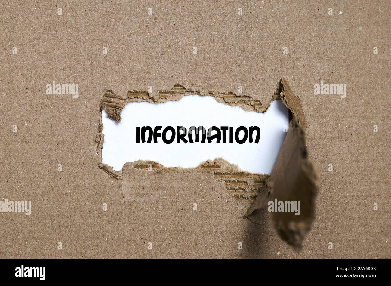 The word information appearing behind torn paper Stock Photo - Alamy