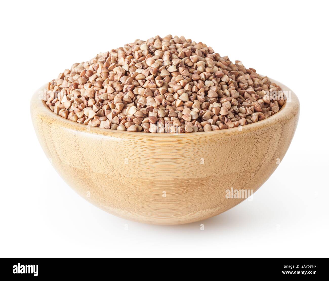 Roasted buckwheat grains in wooden bowl isolated on white background ...