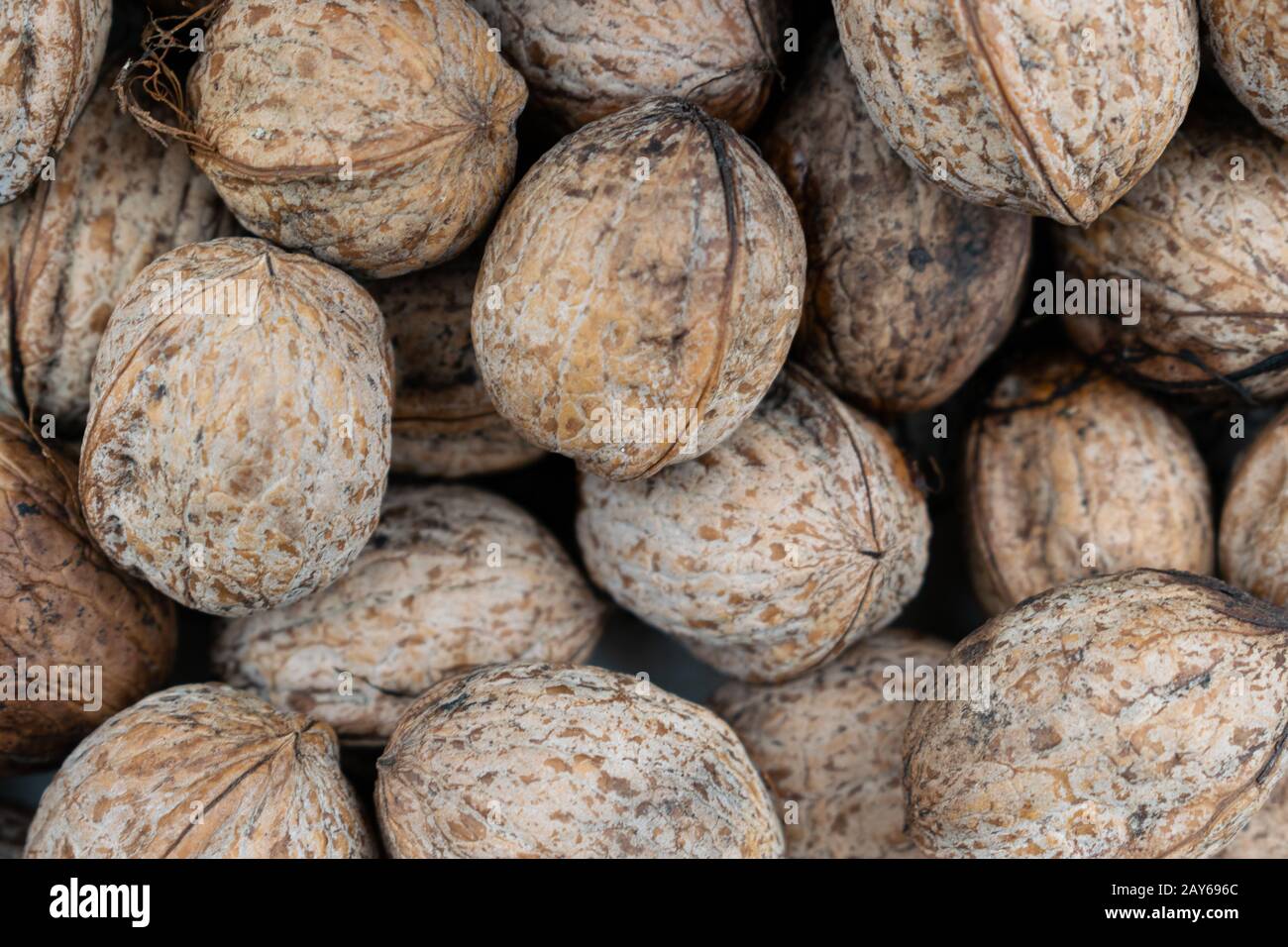 Peeled walnuts left to dry, top view background Stock Photo - Alamy
