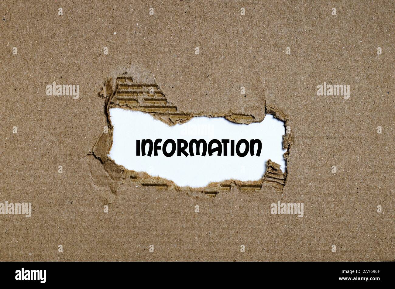 The word information appearing behind torn paper Stock Photo - Alamy