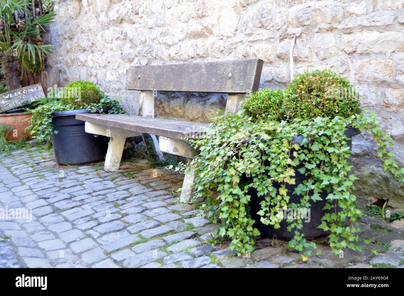 Bench in lamellas of brown wood in a wooden corner Stock Photo - Alamy