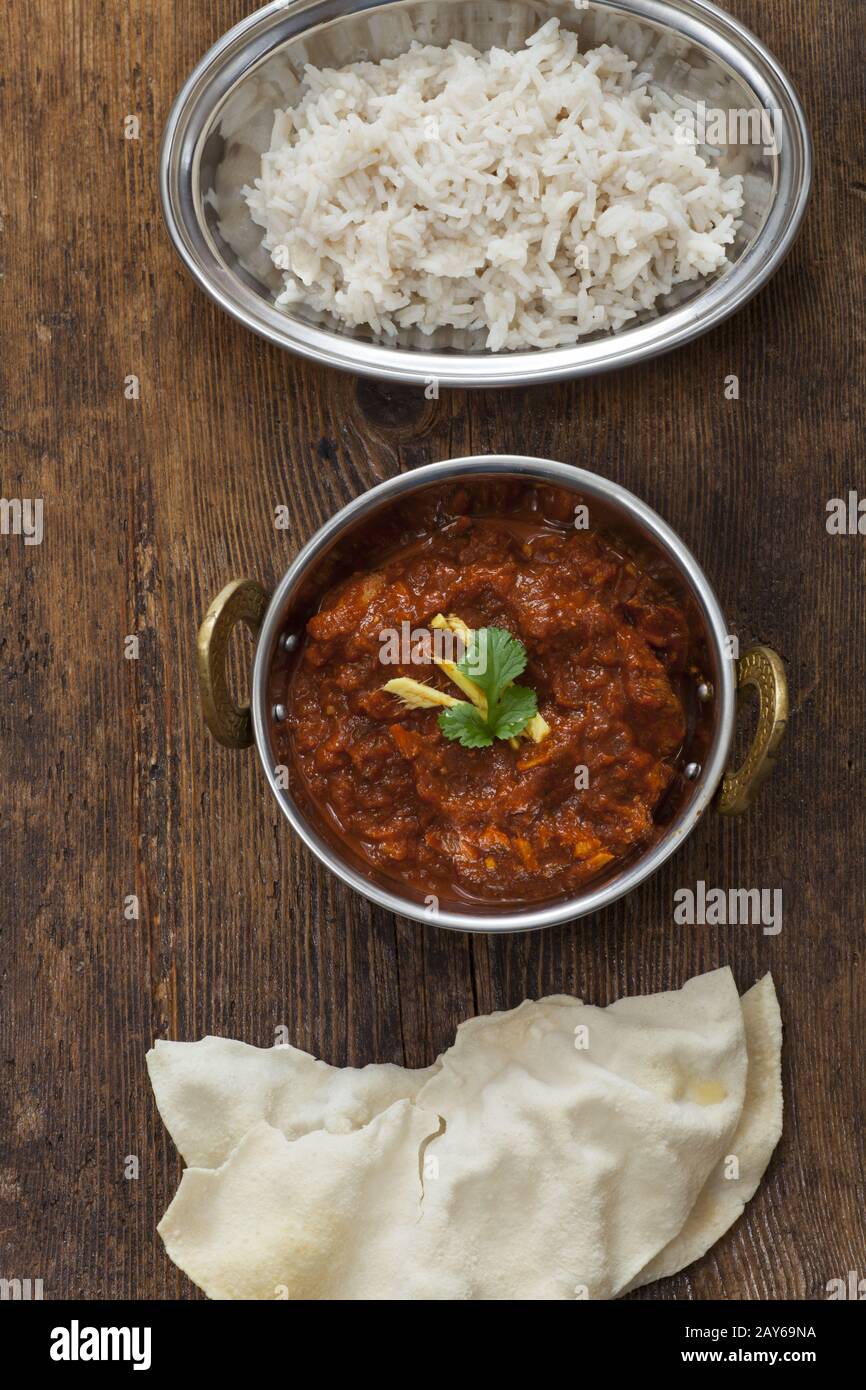 Indian chicken curry in a pot Stock Photo - Alamy