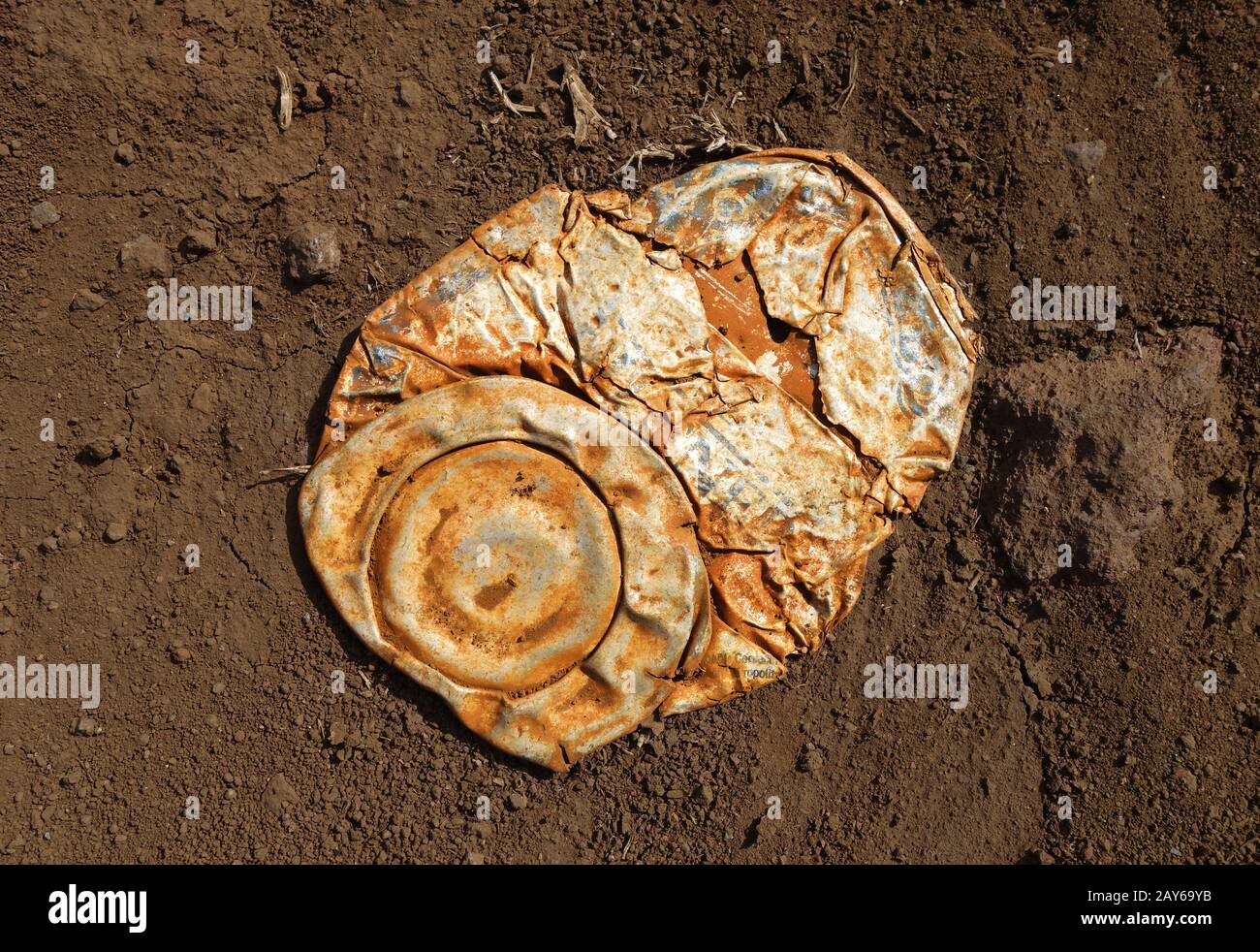 Old crushed rusty tin can Stock Photo - Alamy