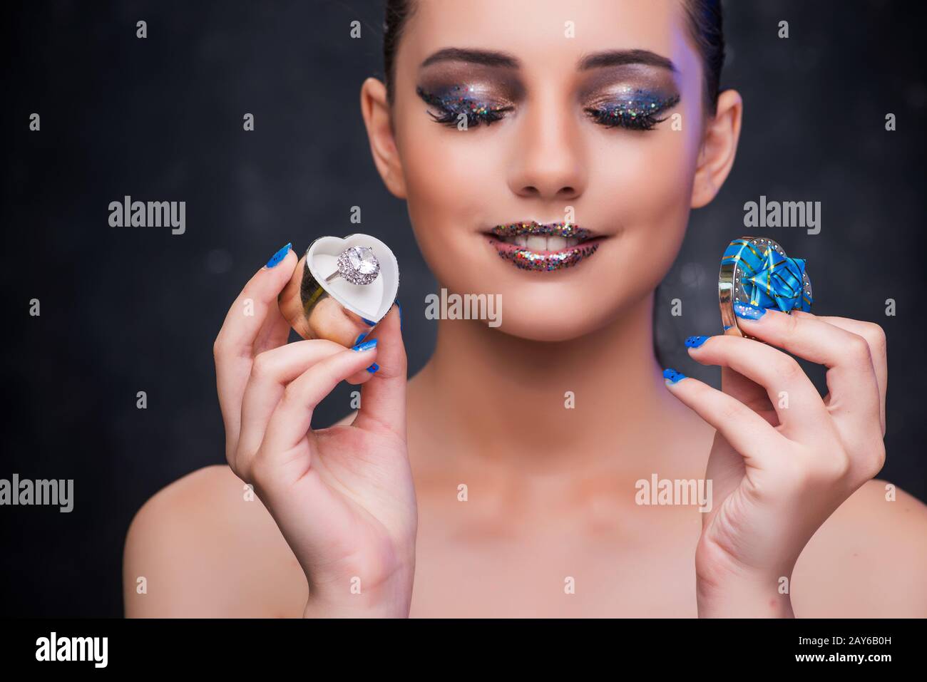 Young woman receiving proposal with diamond ring Stock Photo - Alamy