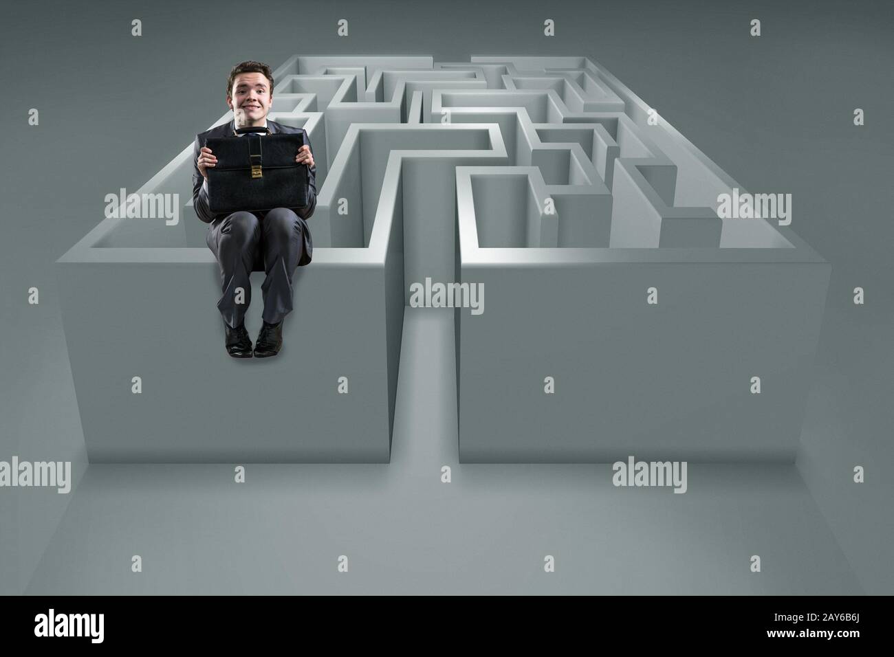 Businessman with maze in difficult situations concept Stock Photo - Alamy