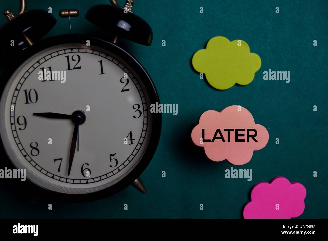 Later write on a sticky note isolated on Office Desk Stock Photo - Alamy