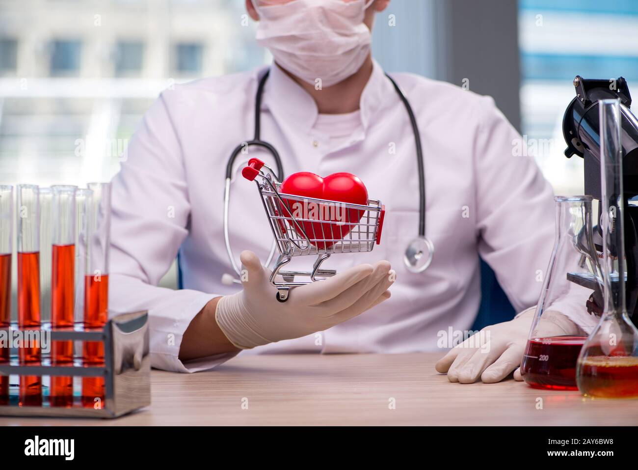Doctor curing heart in medical concept Stock Photo - Alamy