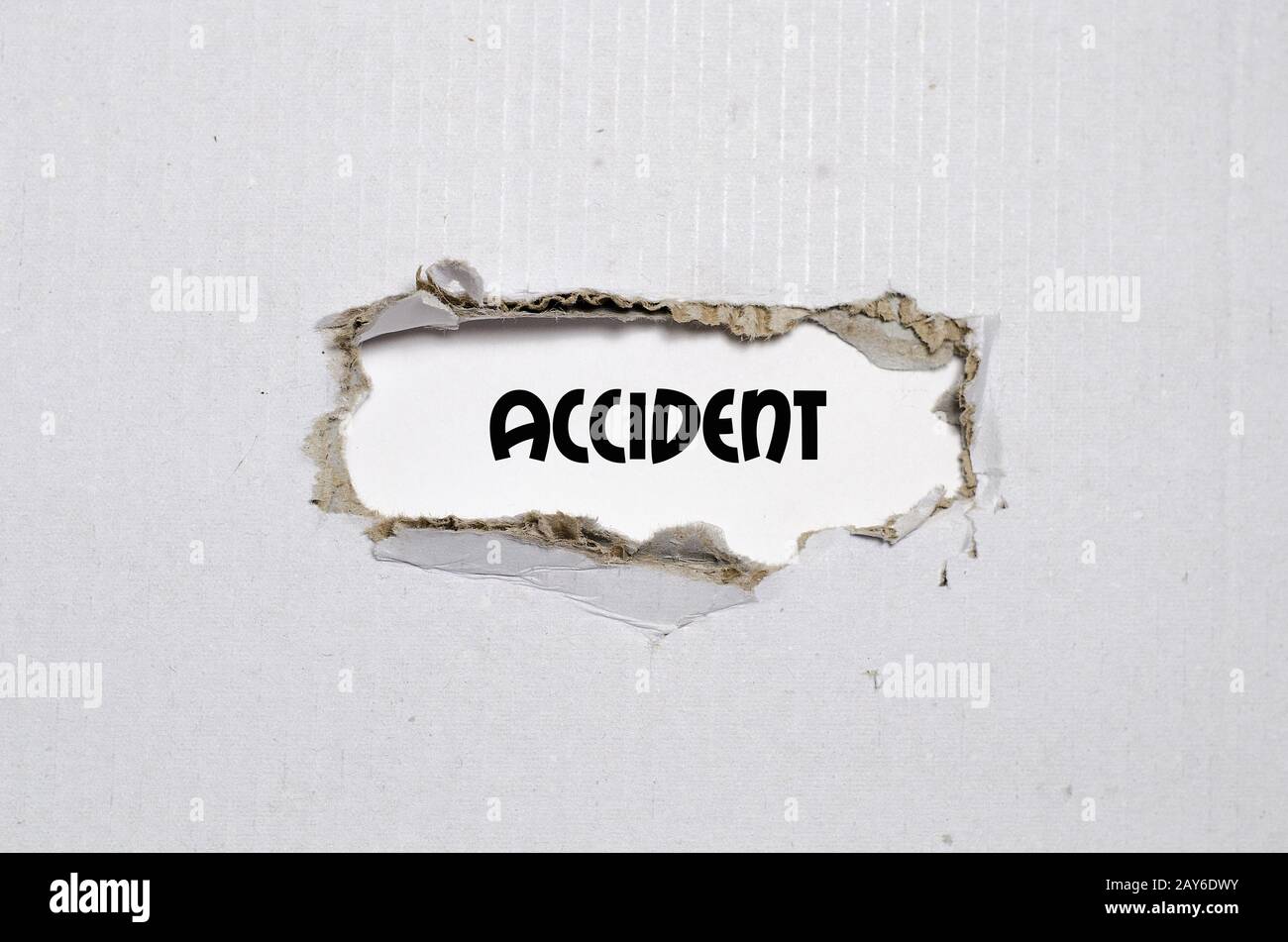 The word accident appearing behind torn paper Stock Photo - Alamy