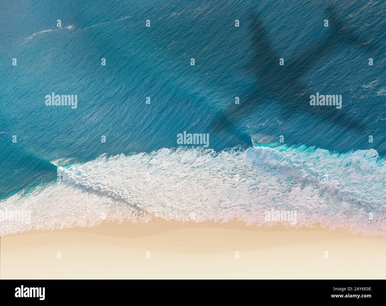 Airplane shadow over the beach - Holidaymakers sunbathing Stock Photo ...
