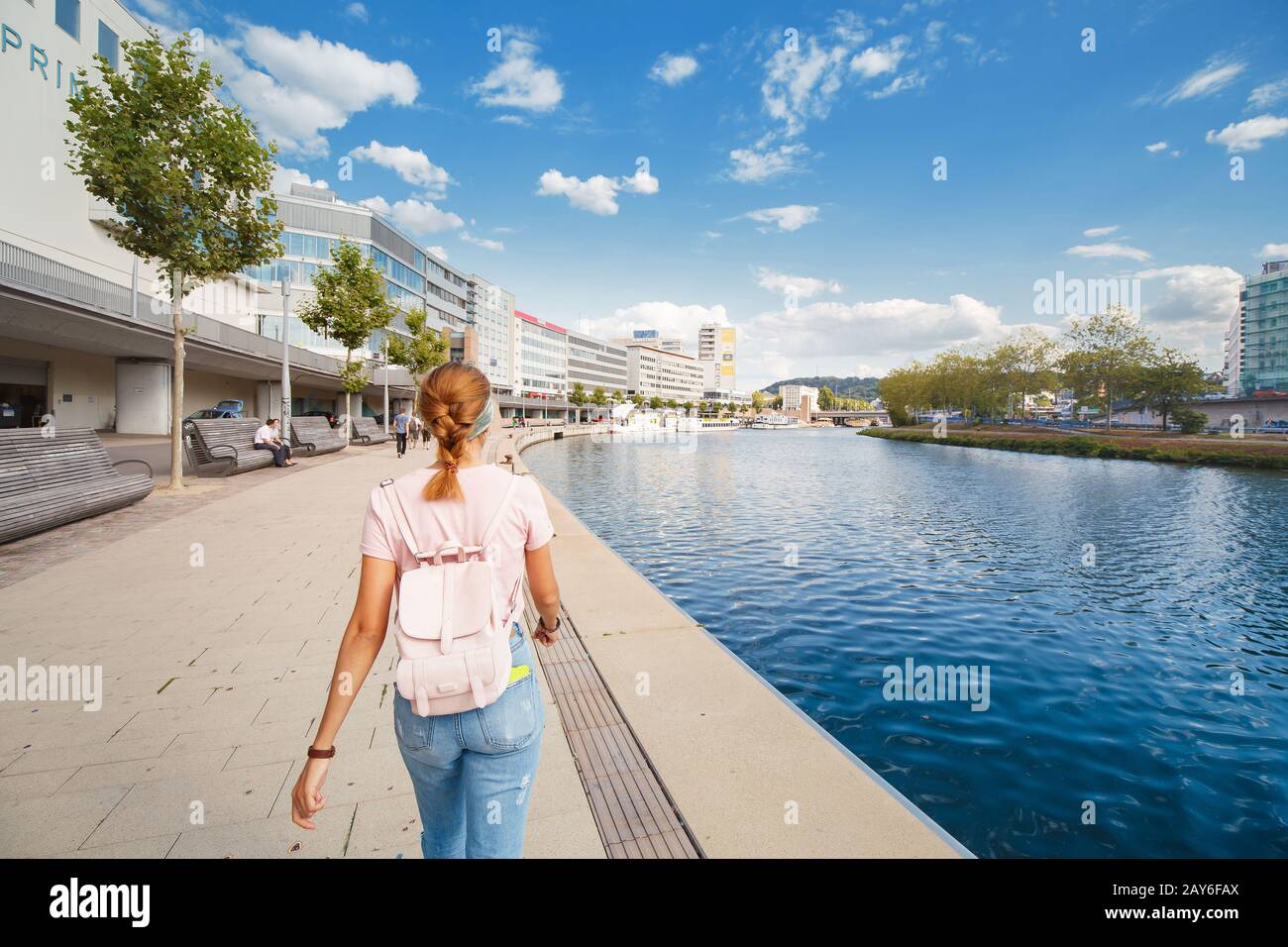 02 August 2019, Saarbrucken, Germany: Girl walking at the Saar river ...