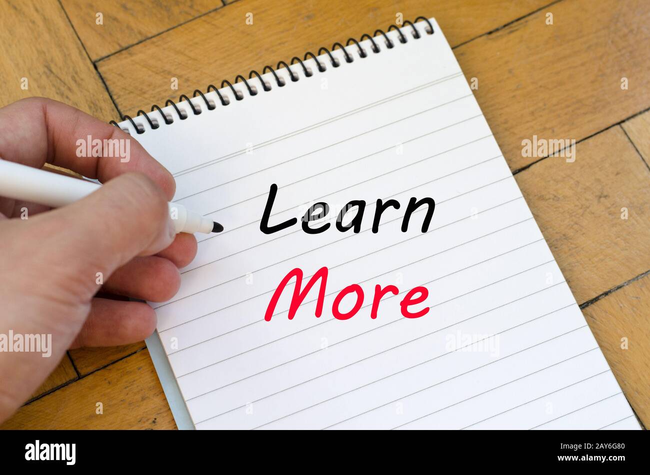 Learn more text concept on notebook Stock Photo - Alamy