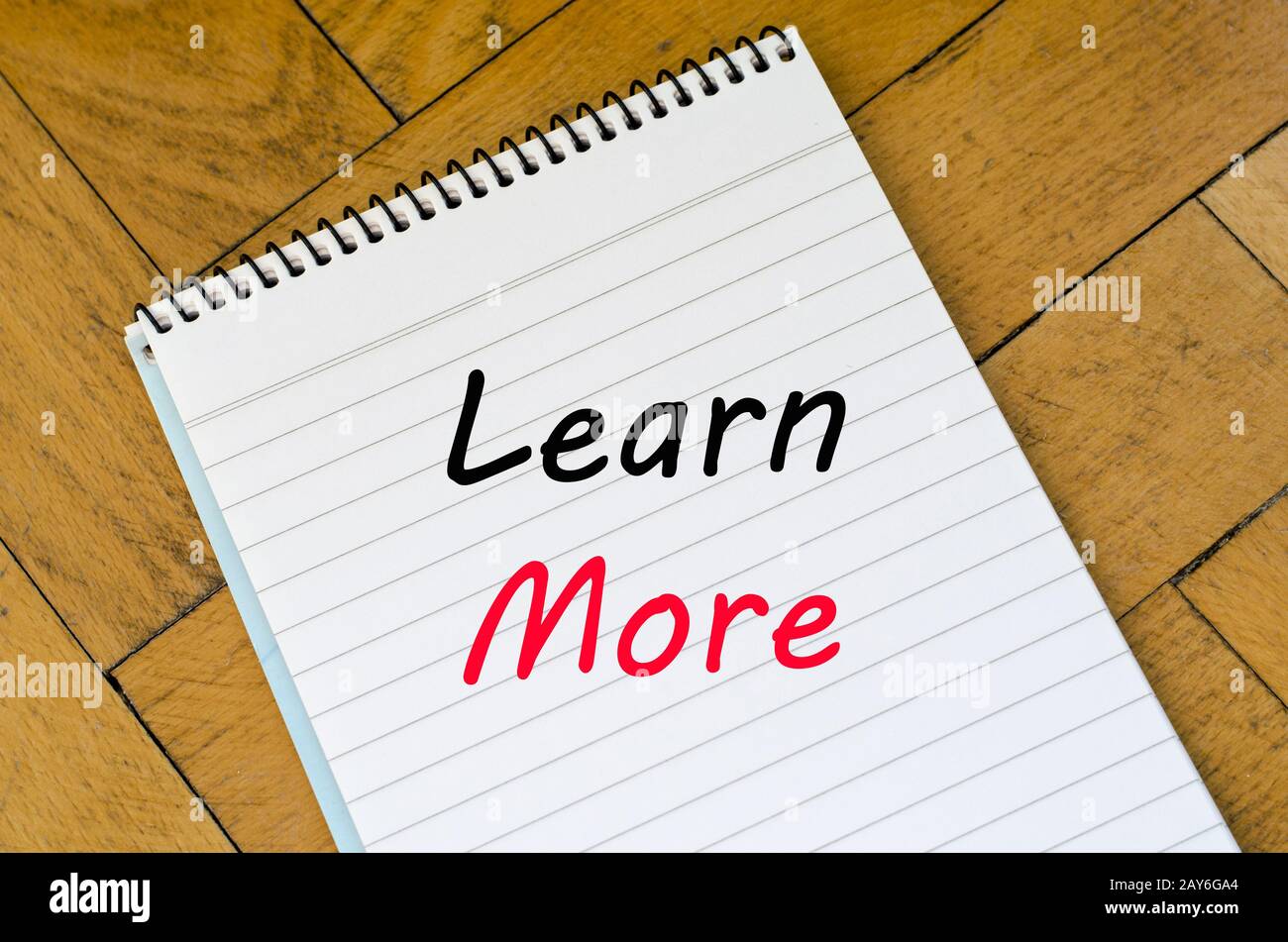Learn more text concept on notebook Stock Photo - Alamy