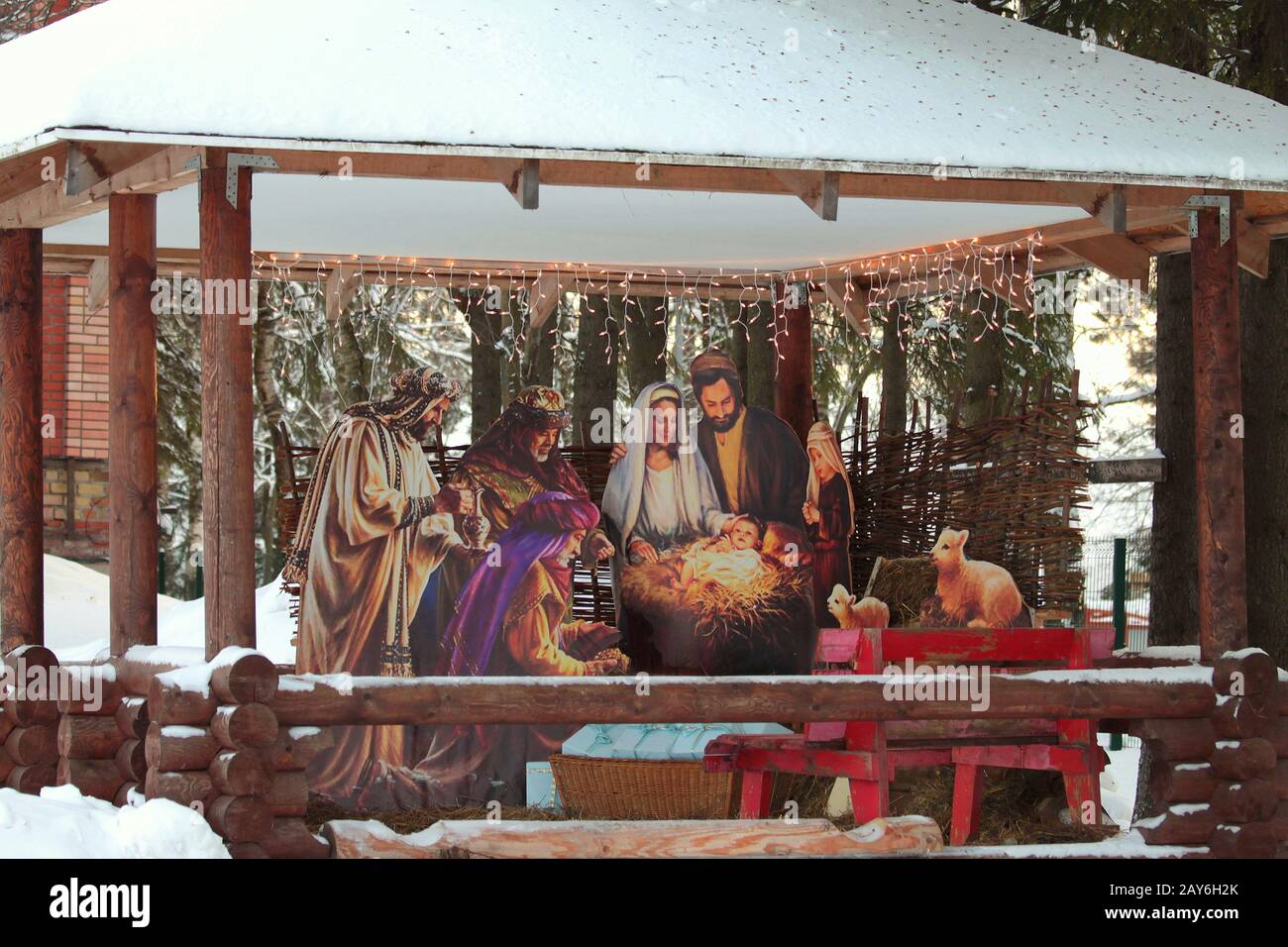 colorful Christmas nativity scene decorated with a luminous garland, a ...