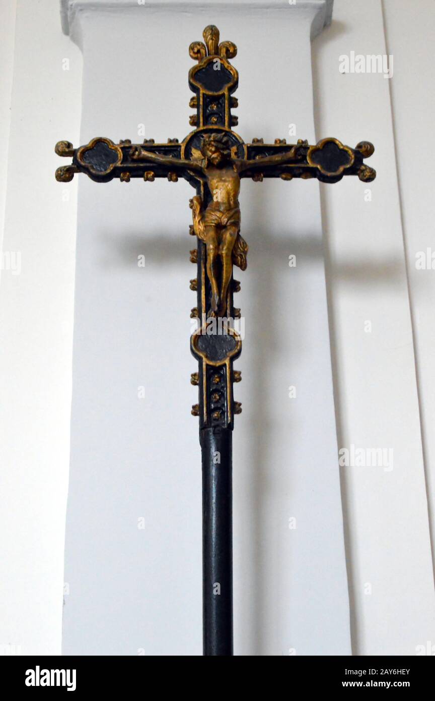 Cross of Christ wrought iron christ fixed on a column Stock Photo - Alamy