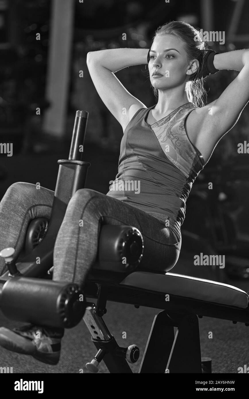 Woman doing strength exercises for abs muscles Stock Photo - Alamy