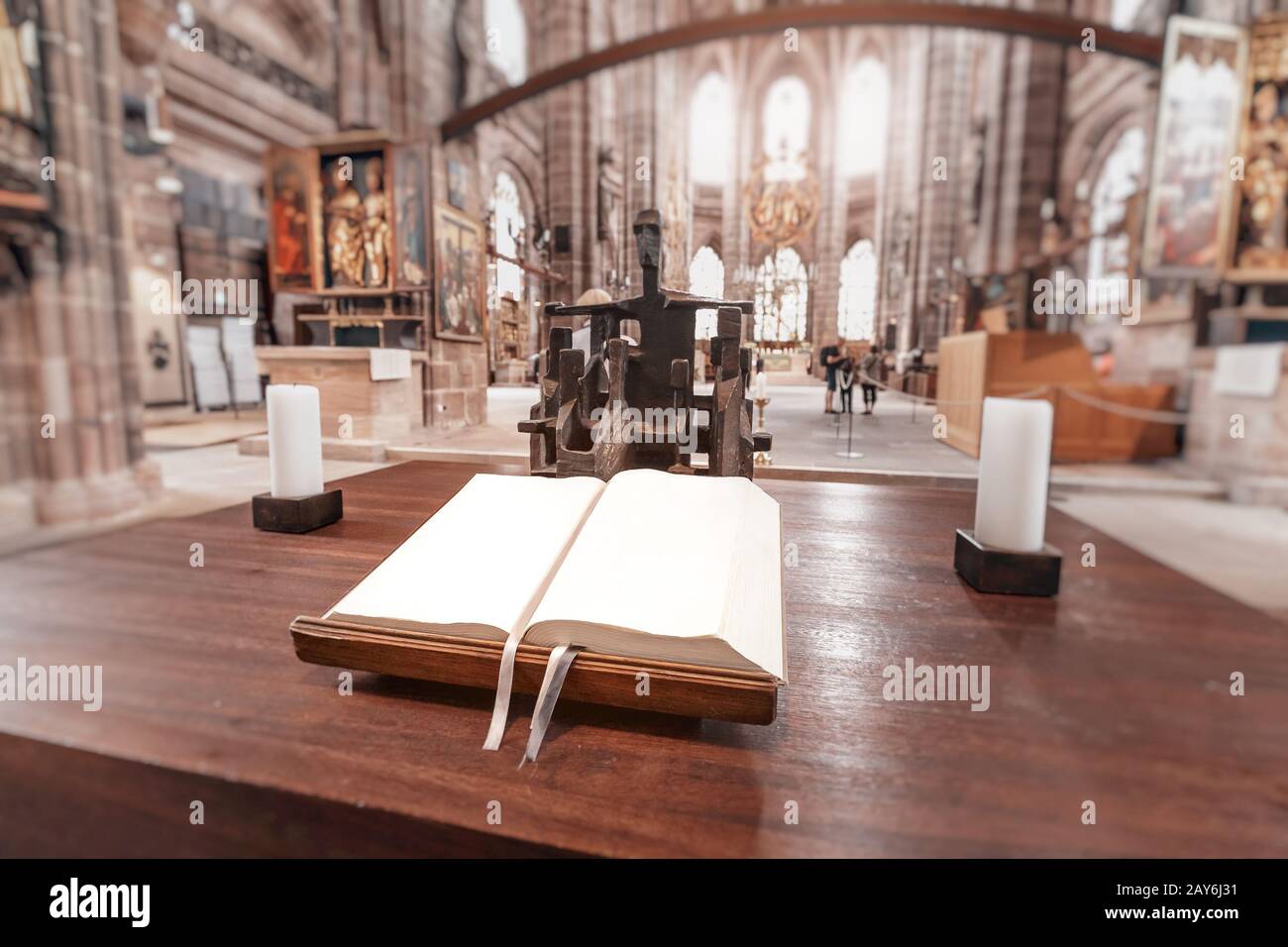 Bible book in church interior Stock Photo - Alamy