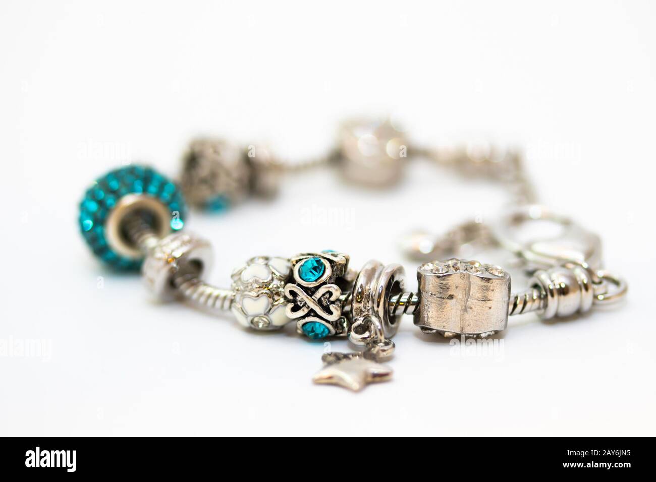 Beautiful bracelet with charms isolated on white background Stock Photo ...