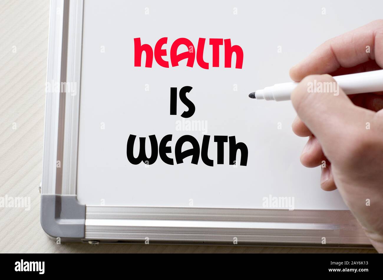 Health is wealth written on whiteboard Stock Photo - Alamy