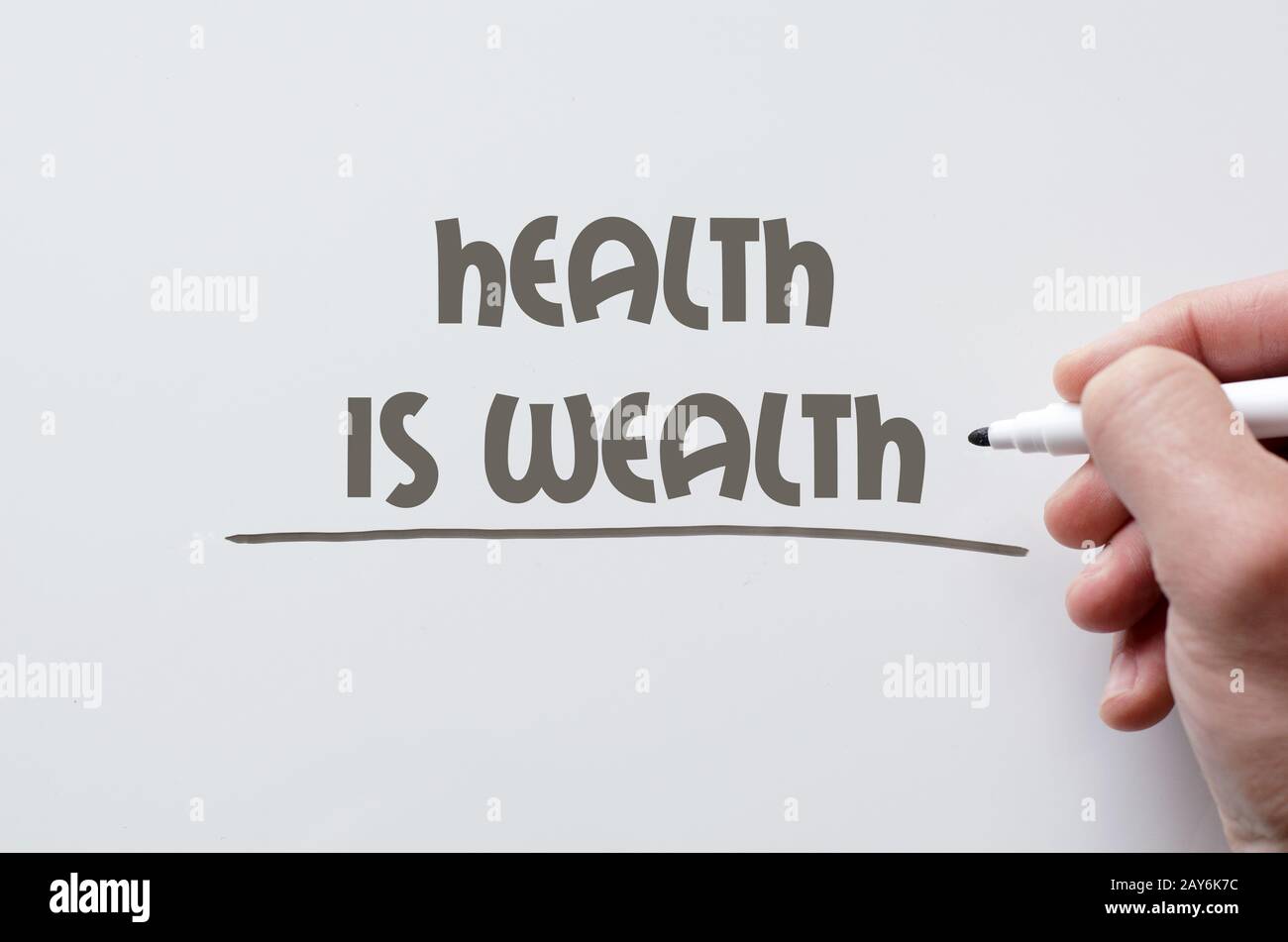 Health is wealth written on whiteboard Stock Photo - Alamy